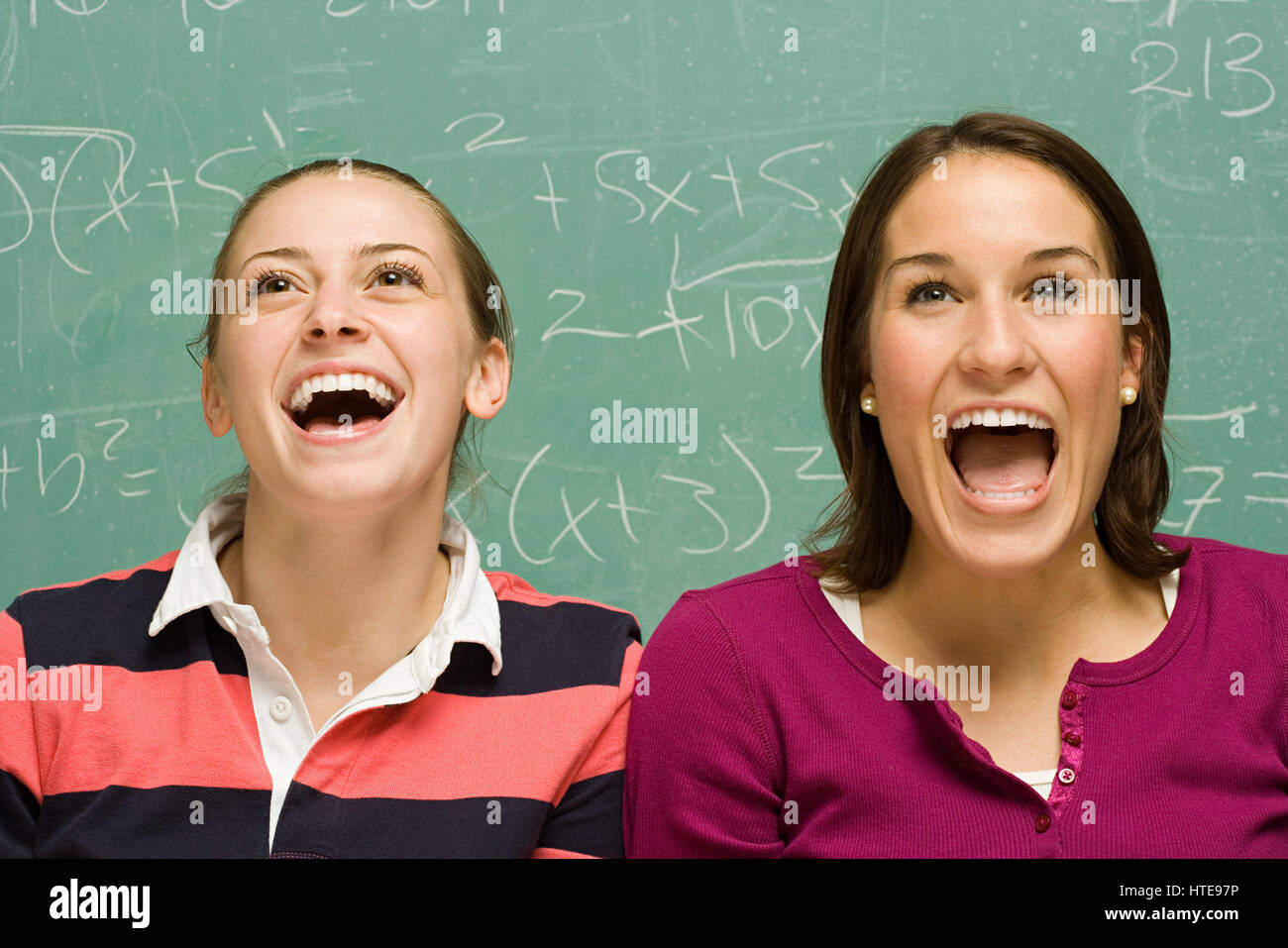 Two female students showing surprise Stock Photo - Alamy