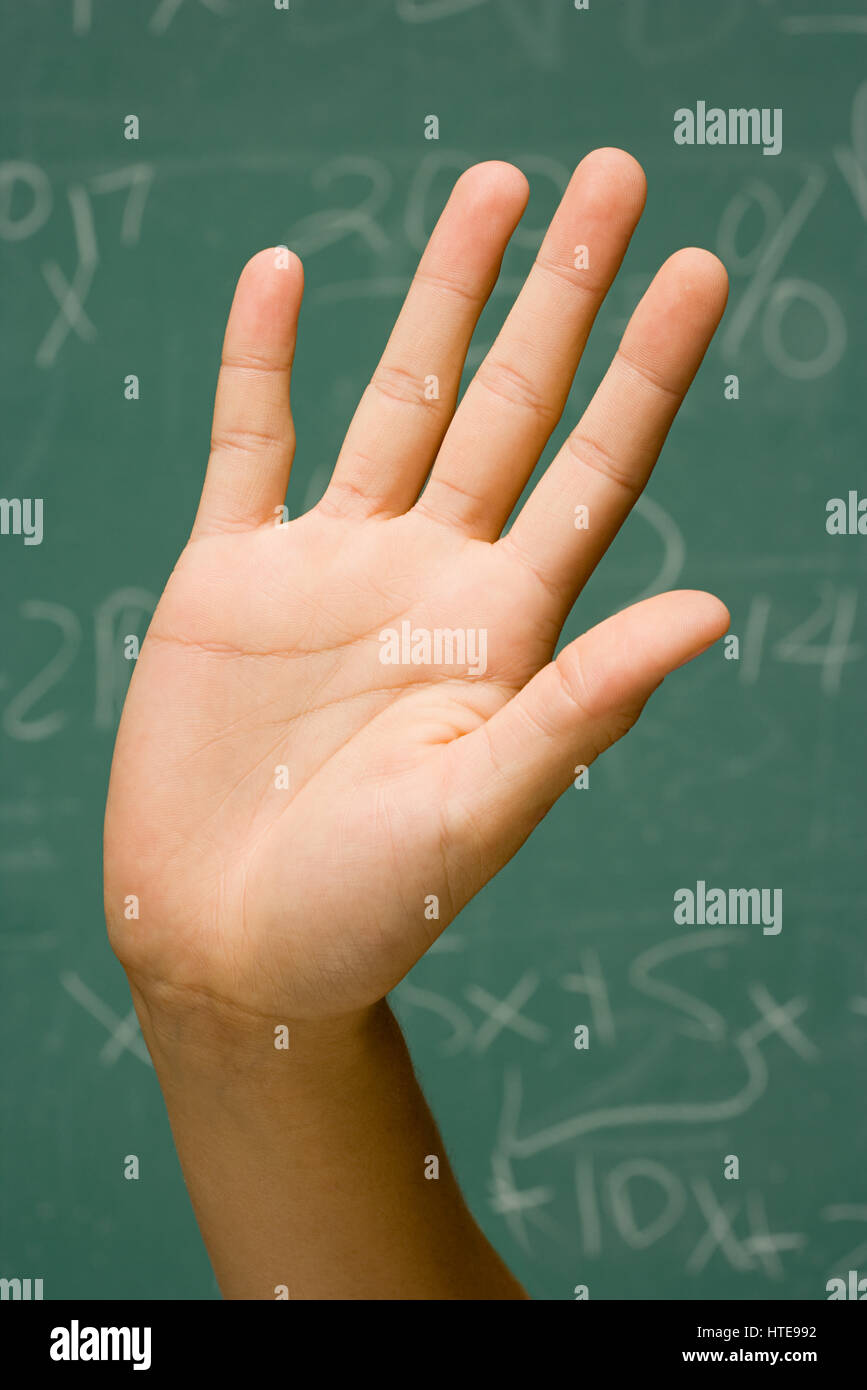 Student with hand raised Stock Photo - Alamy