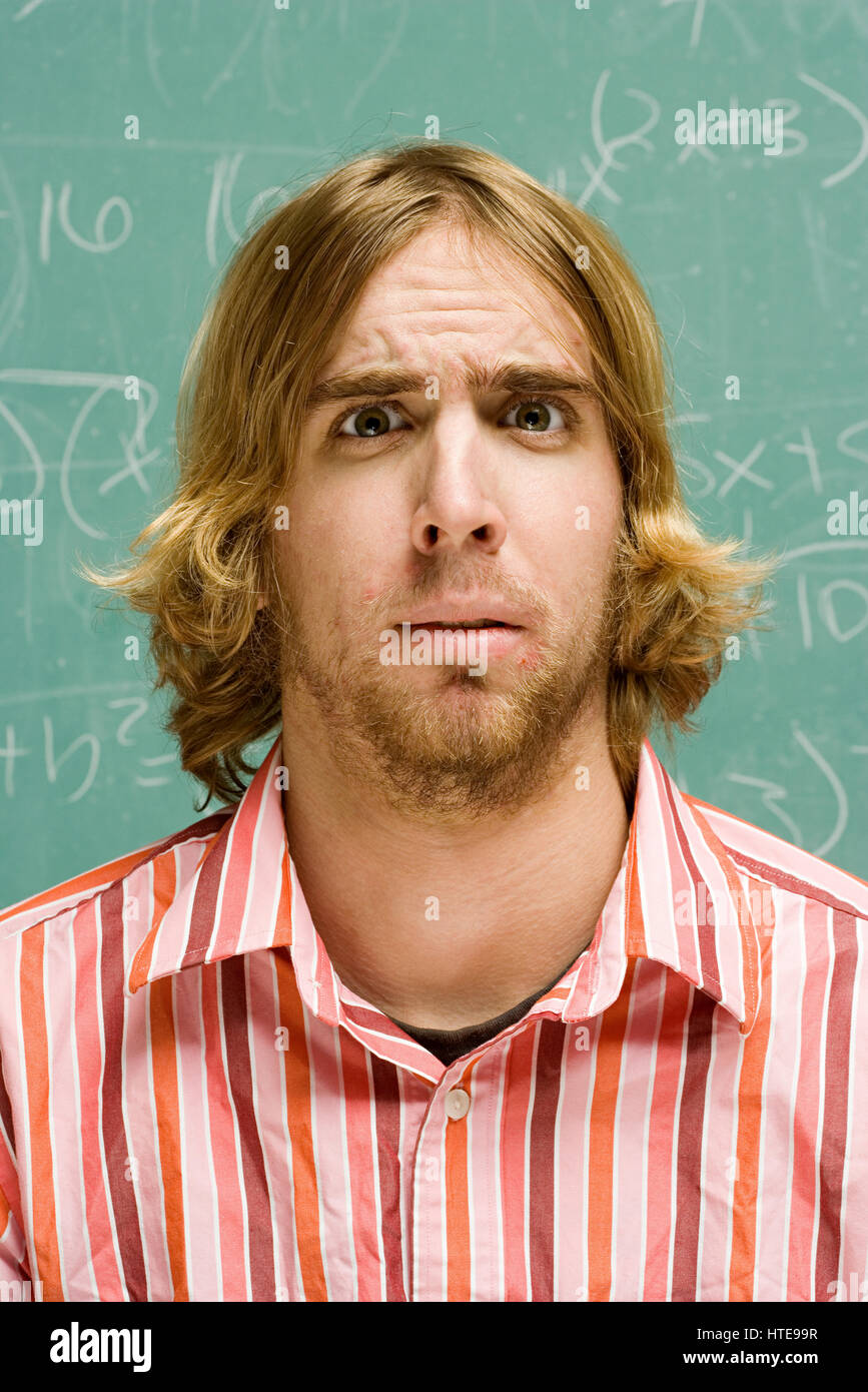 Male student looking confused Stock Photo - Alamy