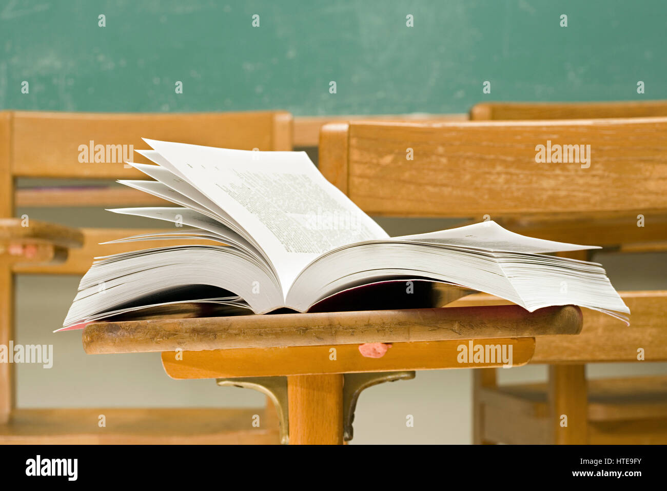 Open book on a desk Stock Photo - Alamy