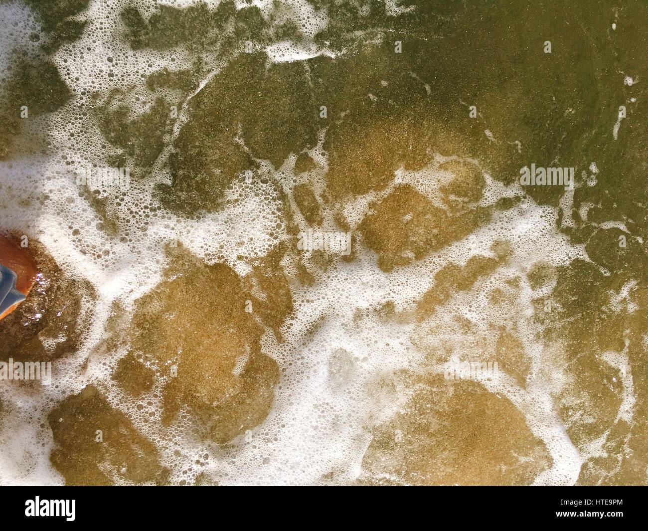 Sea waves reaching lapping to shore Stock Photo - Alamy
