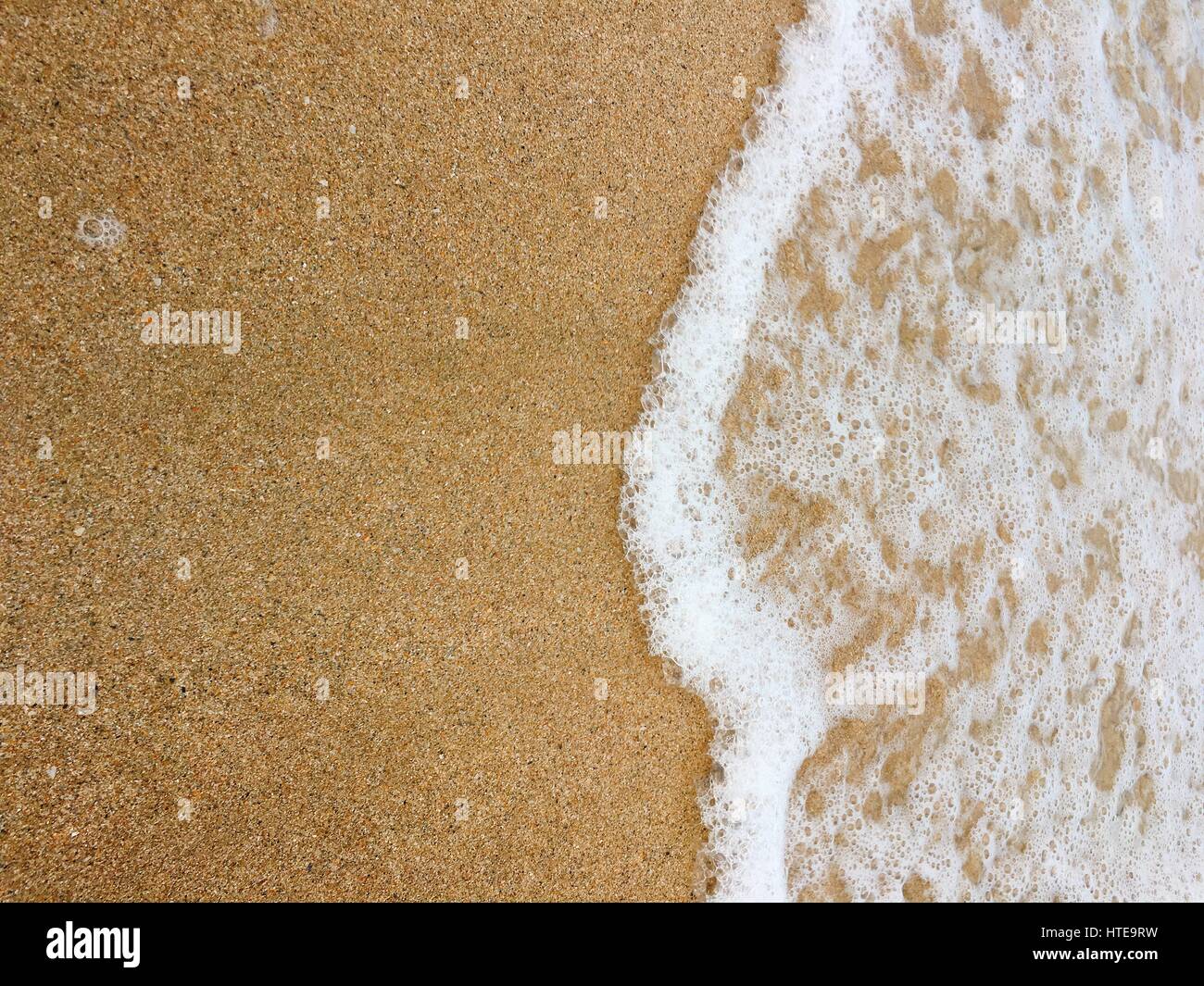 Sea waves reaching lapping to shore Stock Photo - Alamy