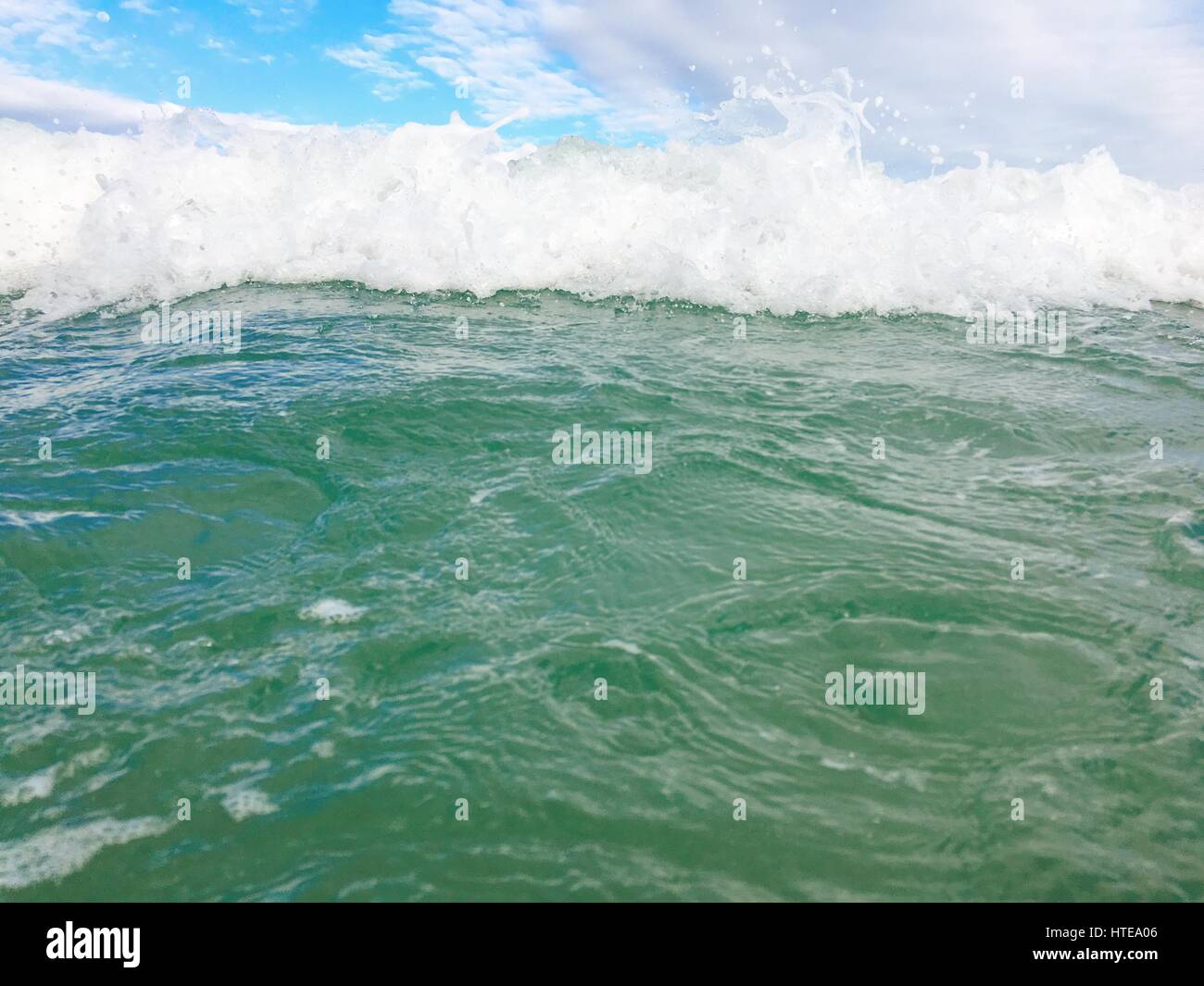 Sea waves reaching lapping to shore Stock Photo - Alamy