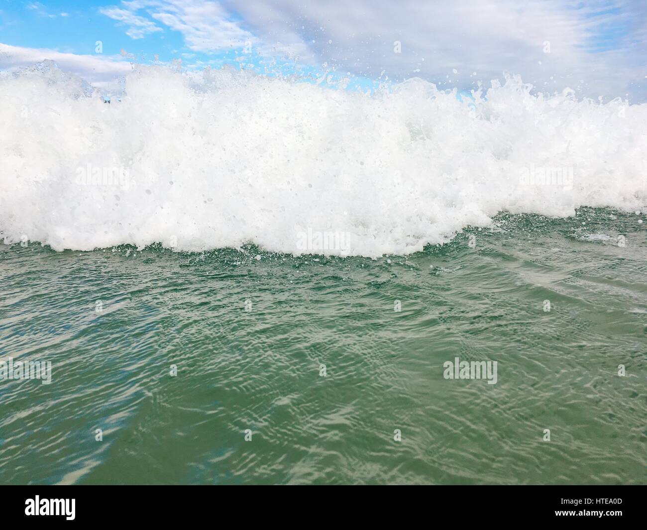 Sea waves reaching lapping to shore Stock Photo - Alamy
