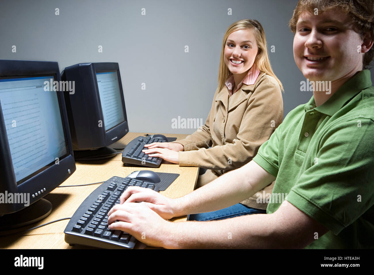 Two students working on computers Stock Photo - Alamy