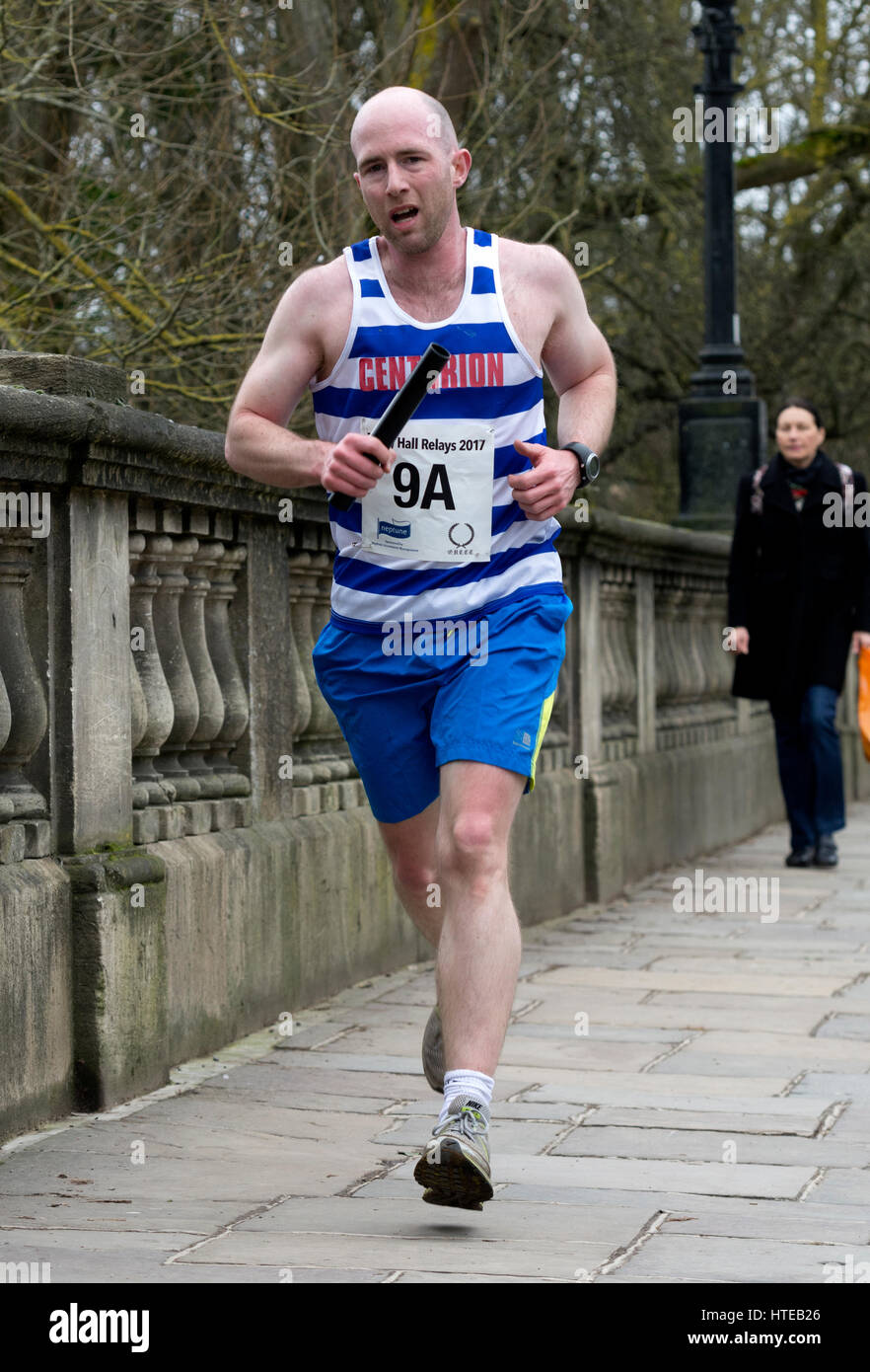 A club runner crossing Magdalen Bridge in the Teddy Hall Relays, Oxford ...