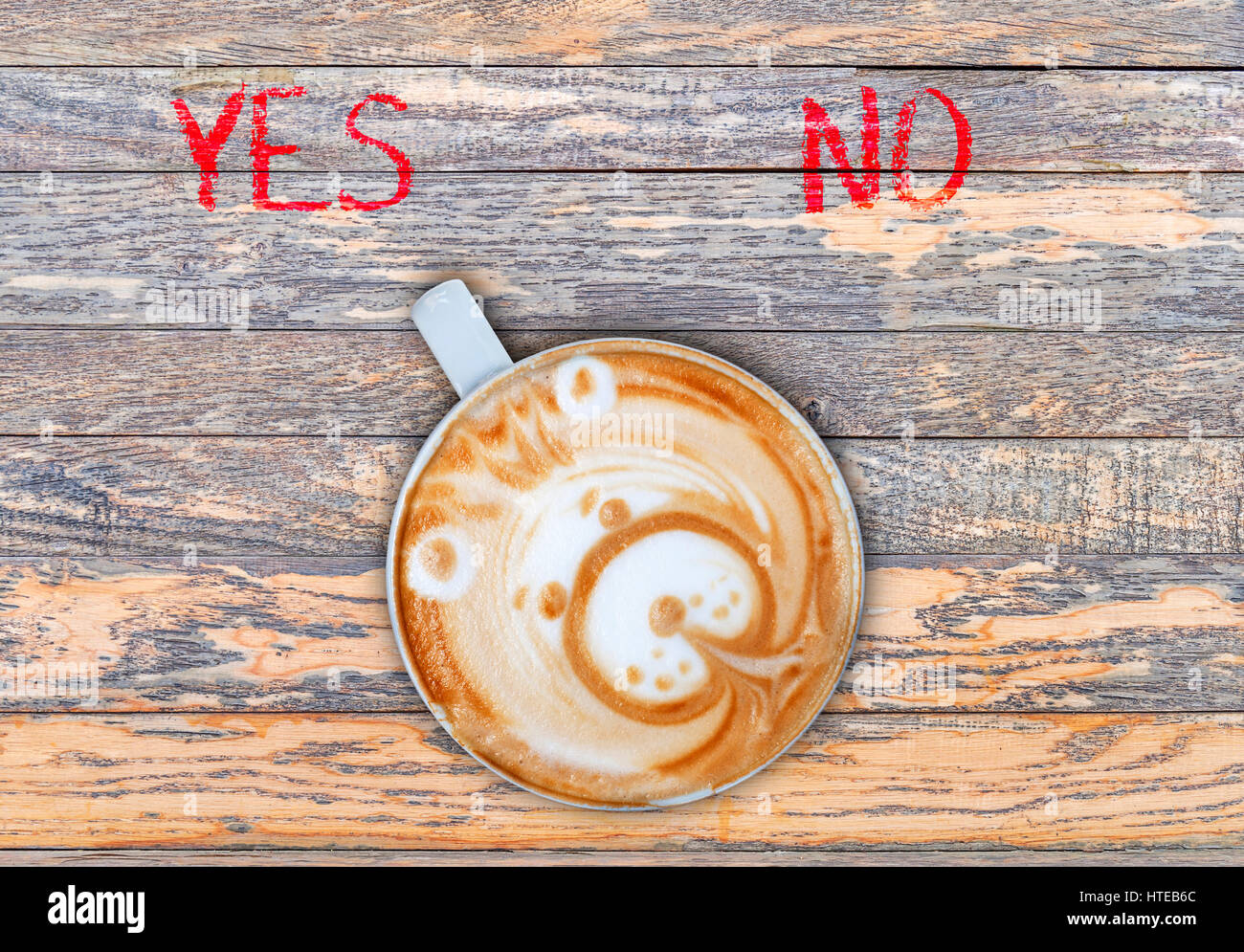Cup of coffee on black board switching yes Stock Photo - Alamy
