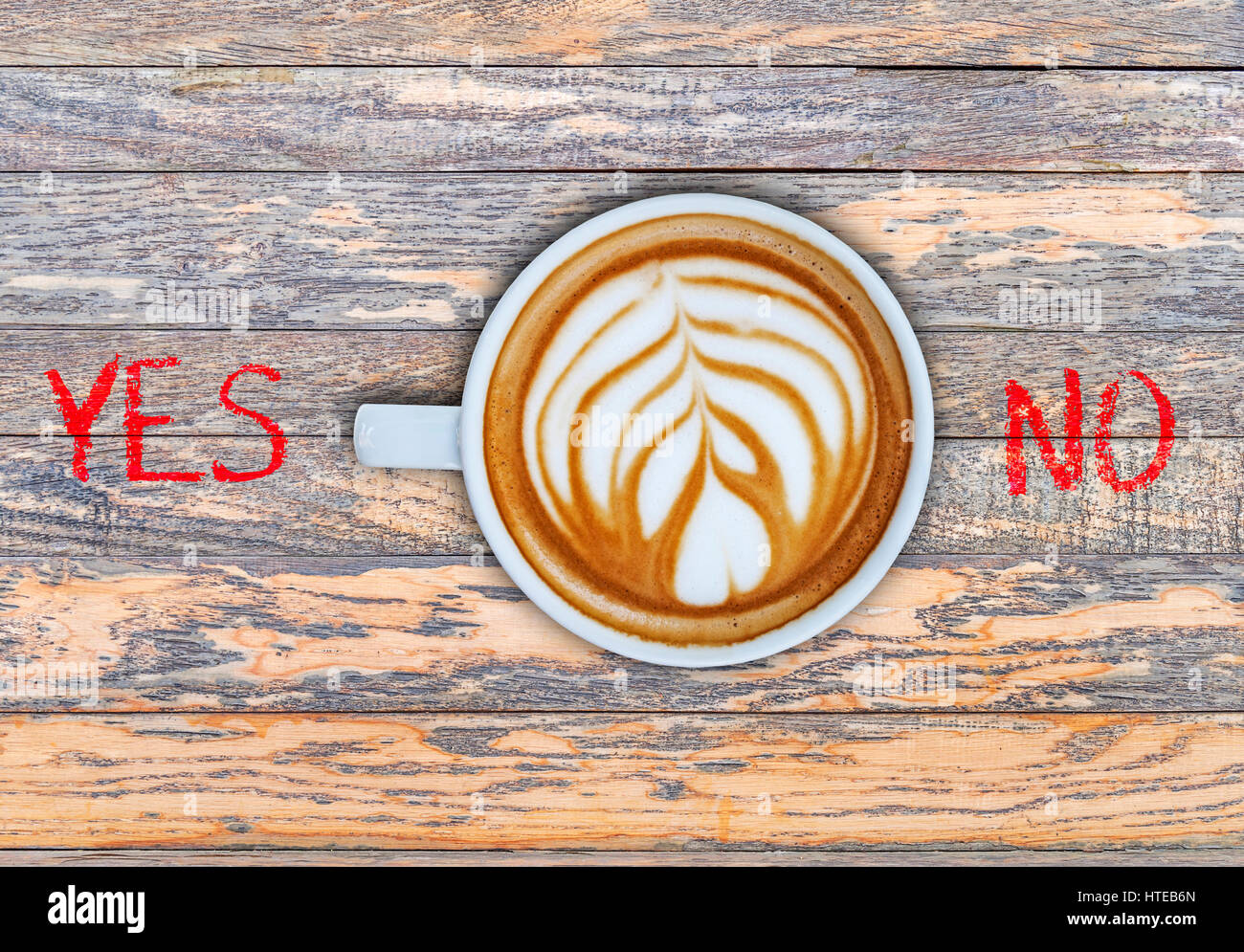 Cup of coffee on black board switching yes Stock Photo - Alamy