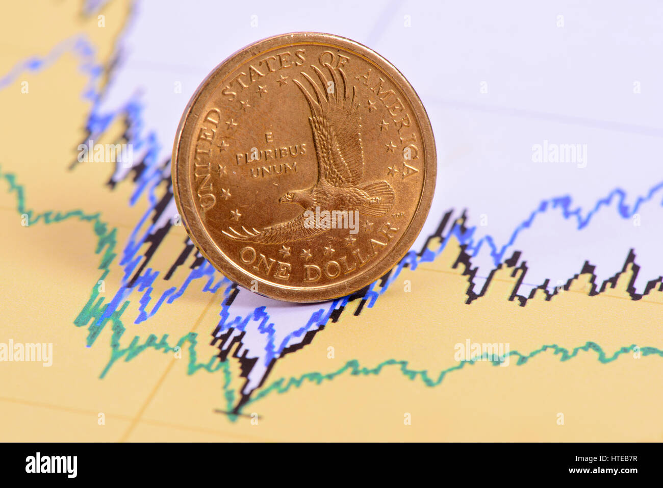 Dollar coin of USA currency laying in chart of exchange market Stock ...