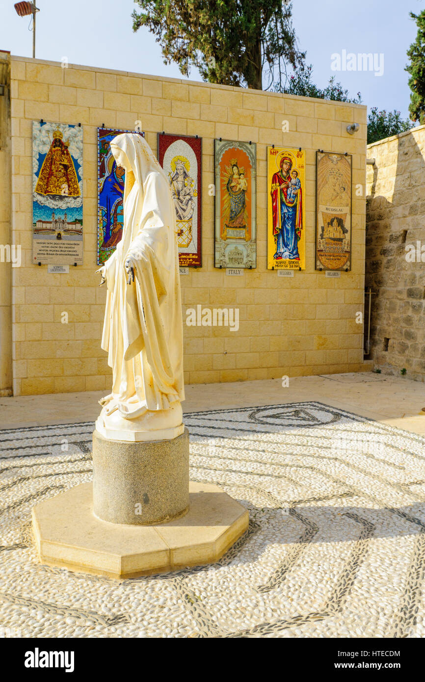 NAZARETH, ISRAEL - DECEMBER 16, 2015: A statue of Mary, with donations ...