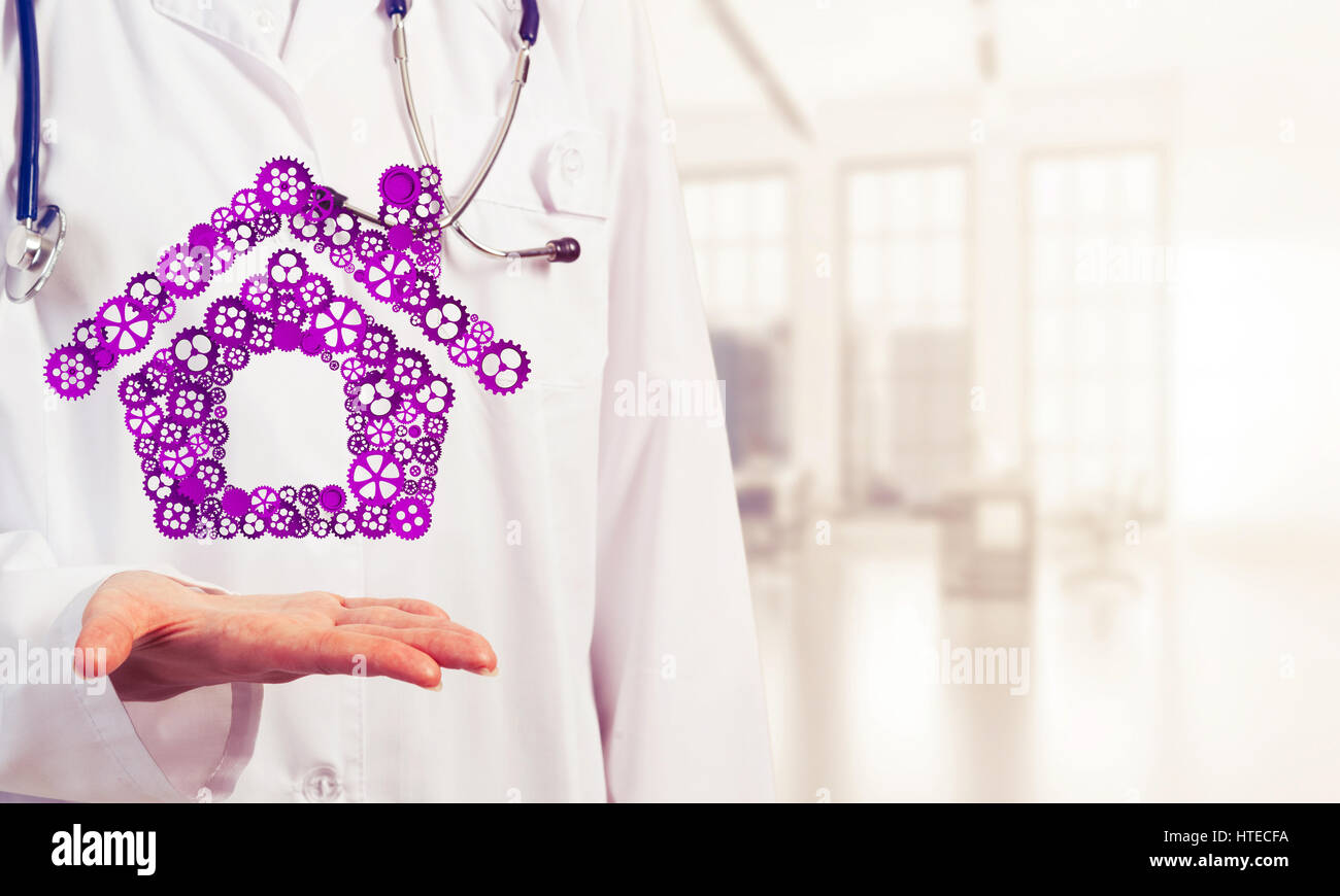 Hand of woman doctor showing house or home gear sign in palm Stock ...