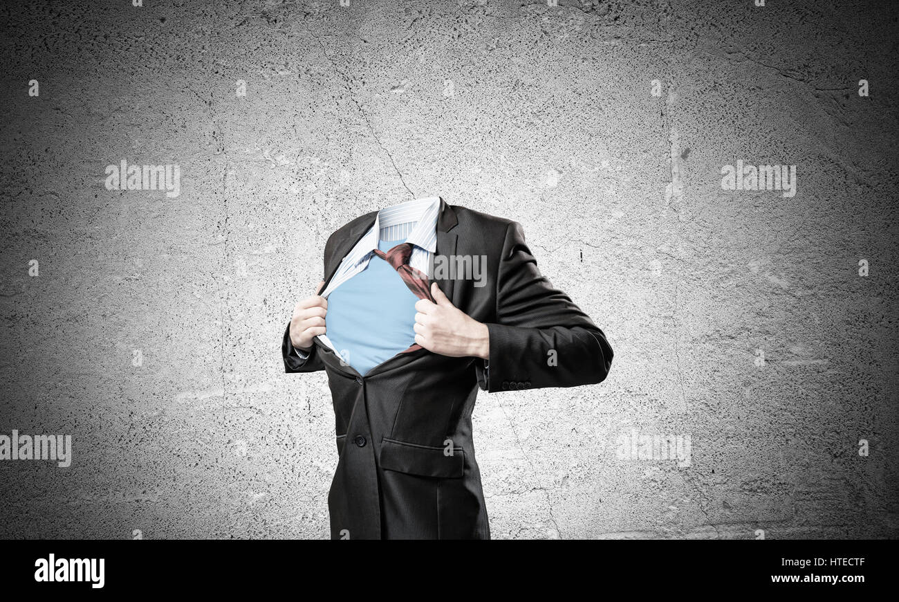 Headless businessman in black suit acting like super hero Stock Photo ...
