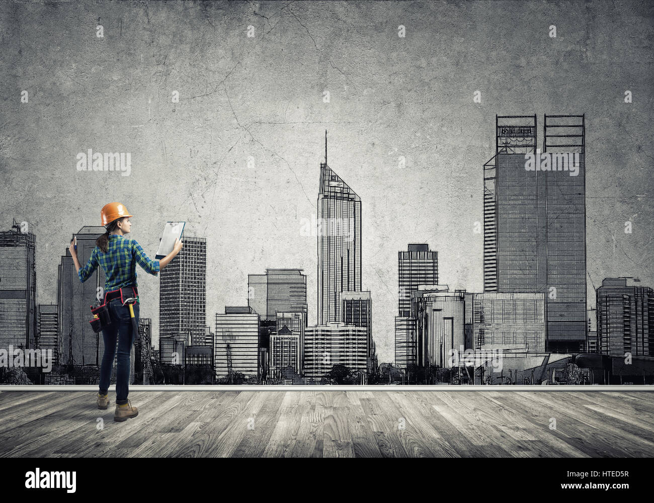 Back view of engineer woman with folder and sketches of construction ...