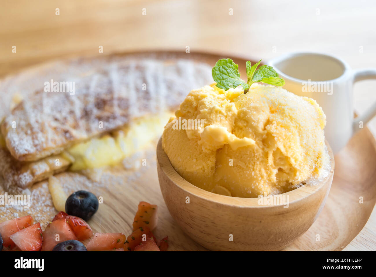 fresh dessert soft vanila roti with ice cream ,syrup ,strawberry and ...