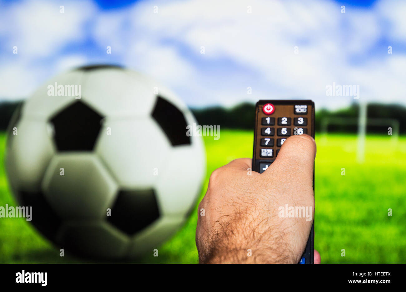 Football match and remote control Stock Photo - Alamy