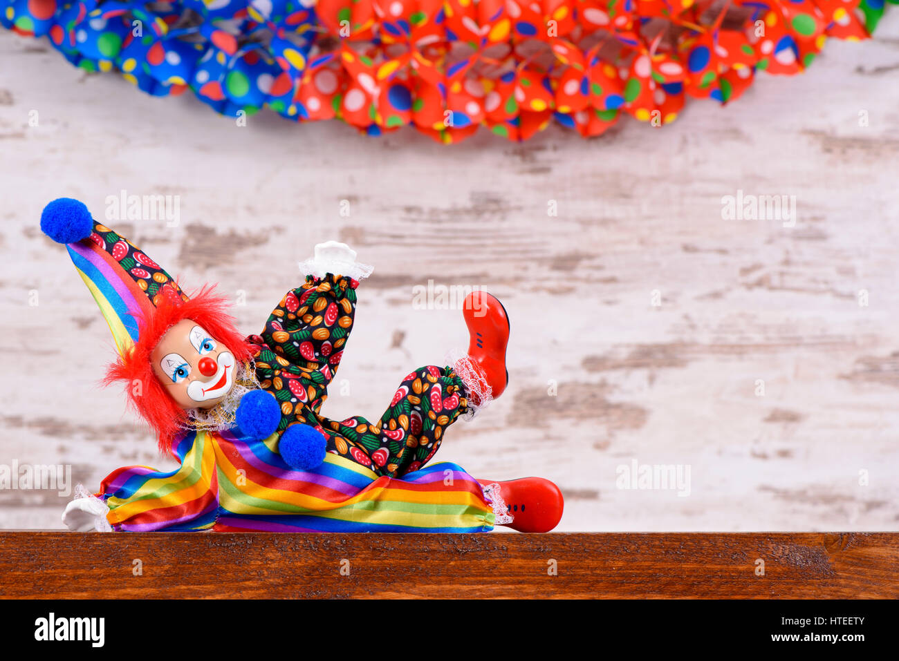 funny clown with colorful costume and paper streamer Stock Photo - Alamy