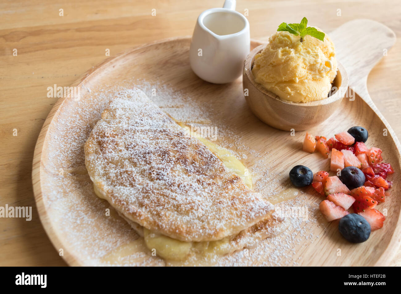 closeup fresh homemade dessert soft vanila roti with cool ice cream ...