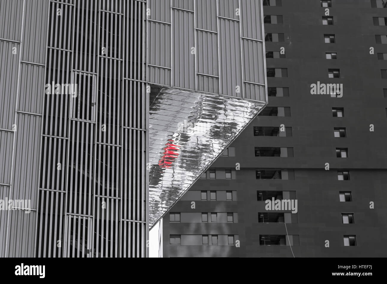 Red car reflection on building Stock Photo - Alamy