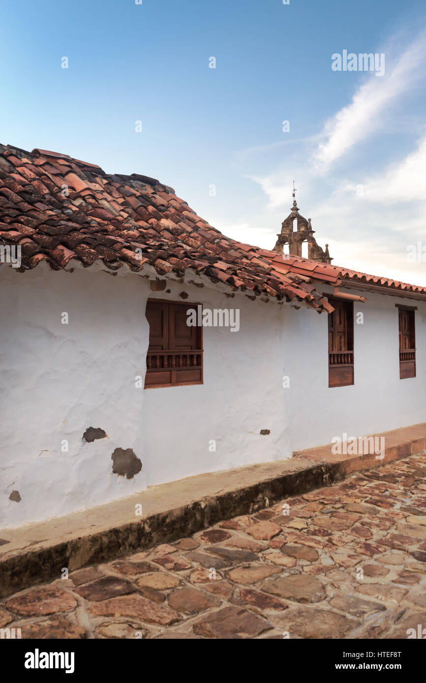 A traditional house with a church facade in the background in Guane ...