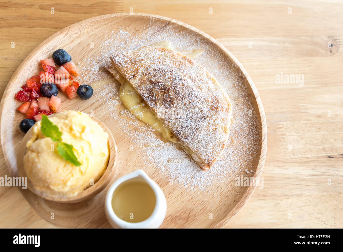 closeup fresh homemade dessert soft vanila roti with cool ice cream ...