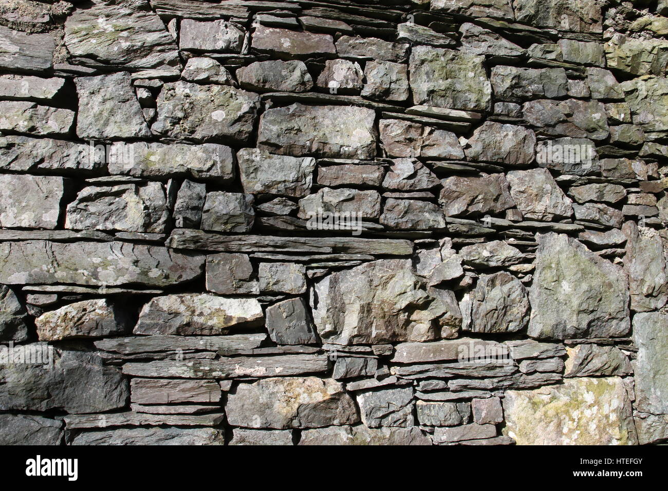 An old stone wall building in the English Lake District, built with ...