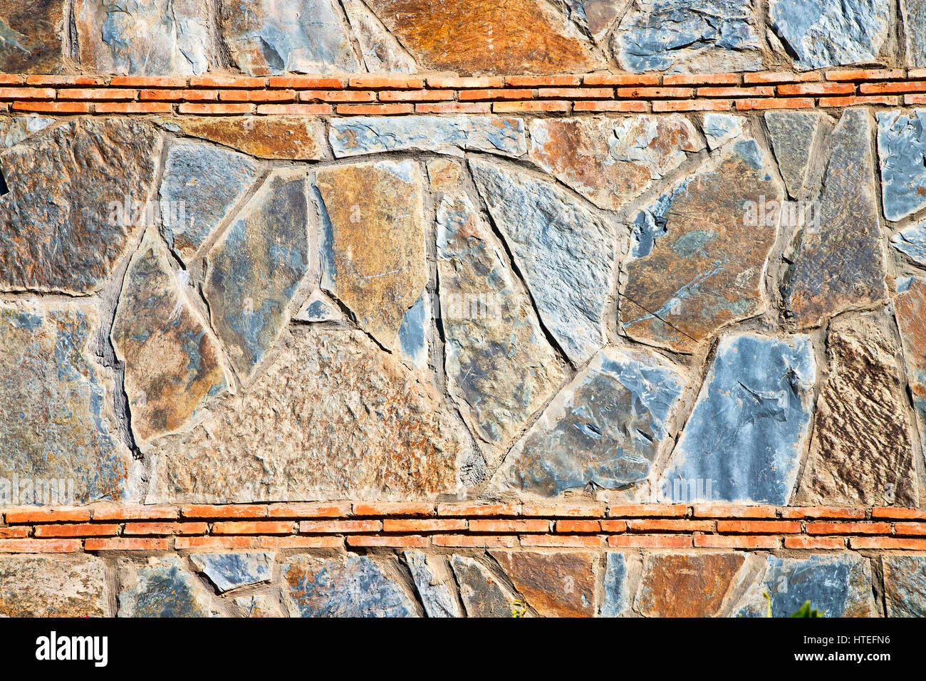 rocks stone and red orange gneiss in the wall of morocco Stock Photo ...