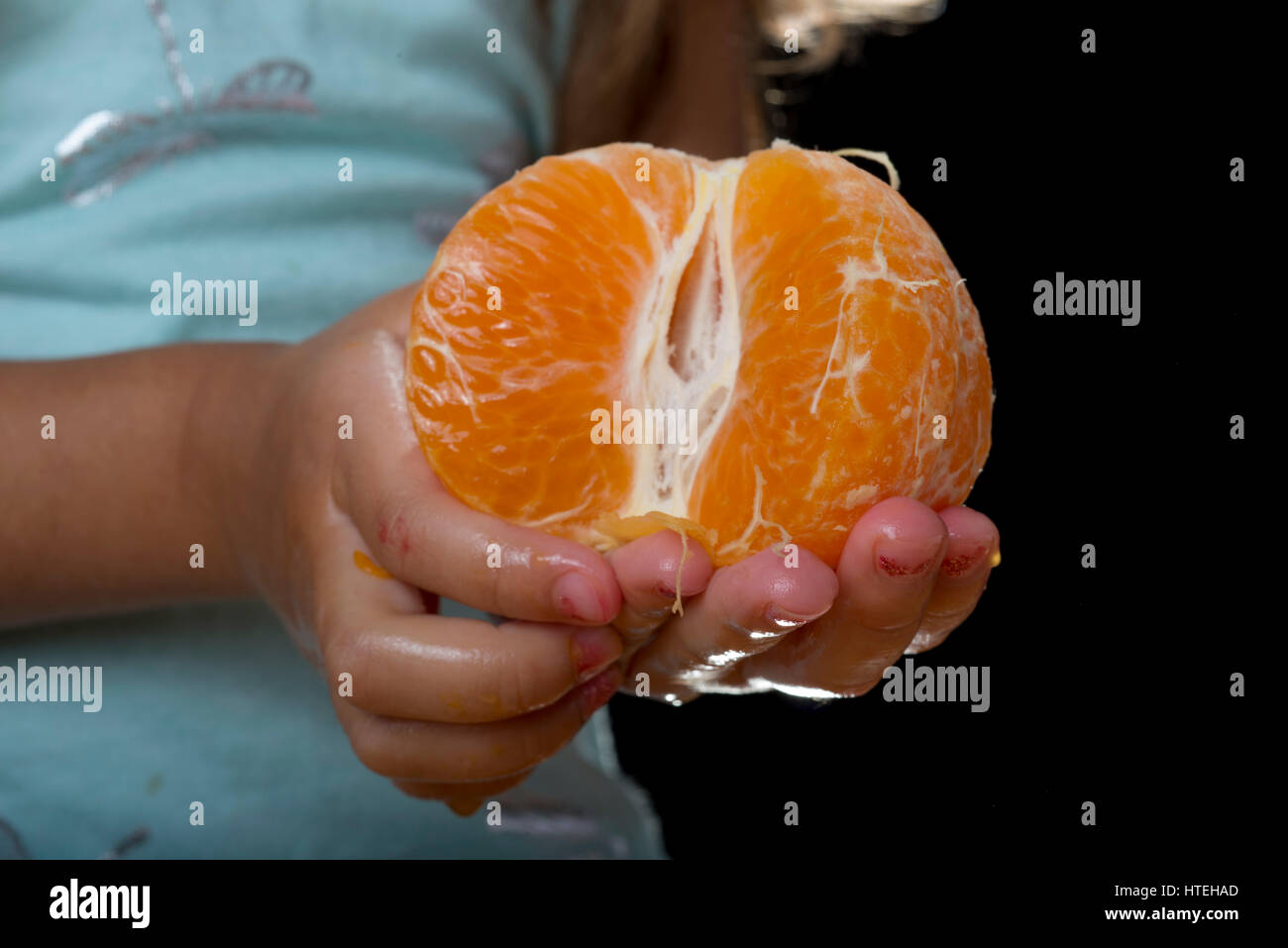 Peeling a tangerine hi-res stock photography and images - Alamy