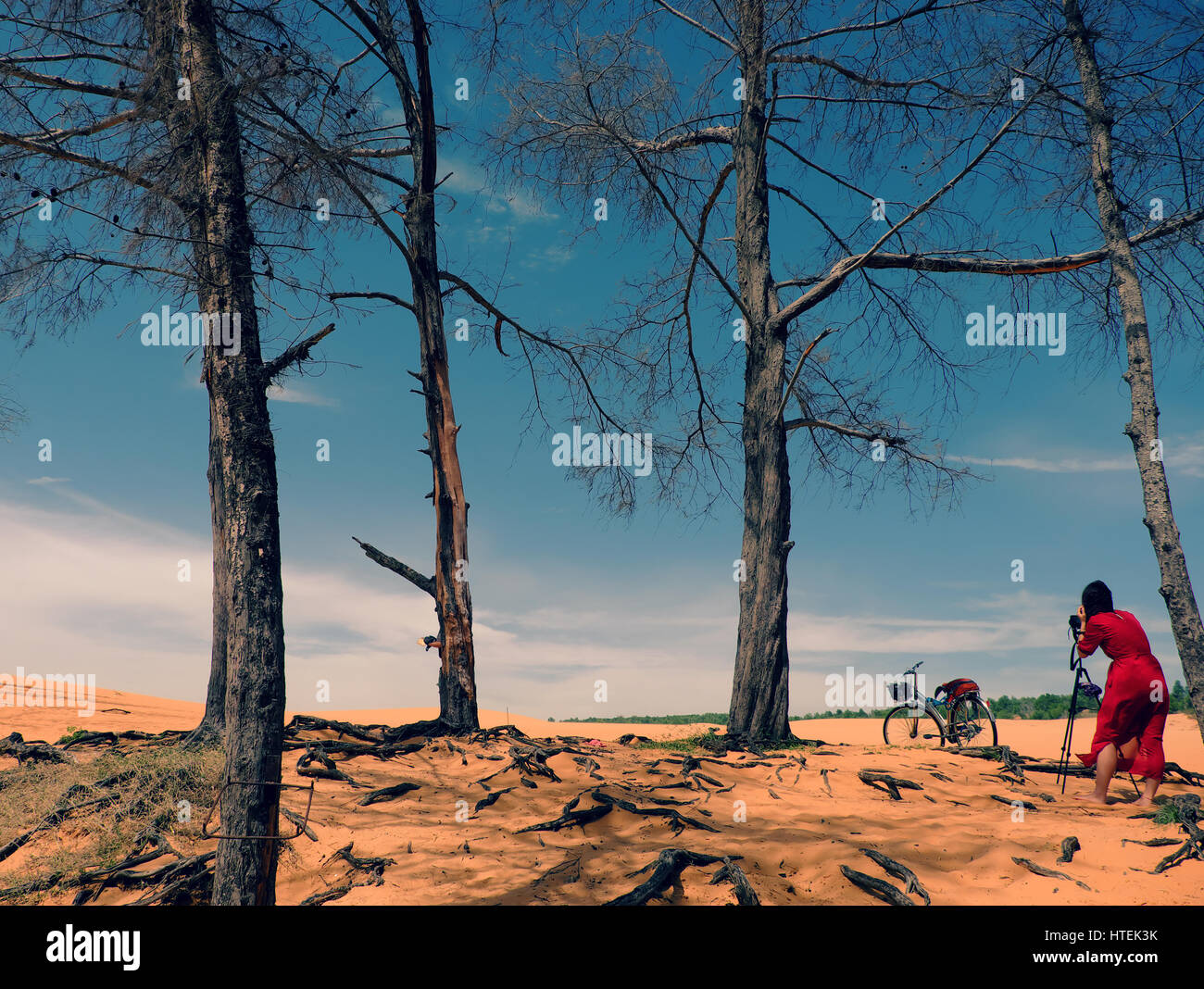 Woman traveling alone at Mui Ne, Vietnam, girl in red dress and selfie ...