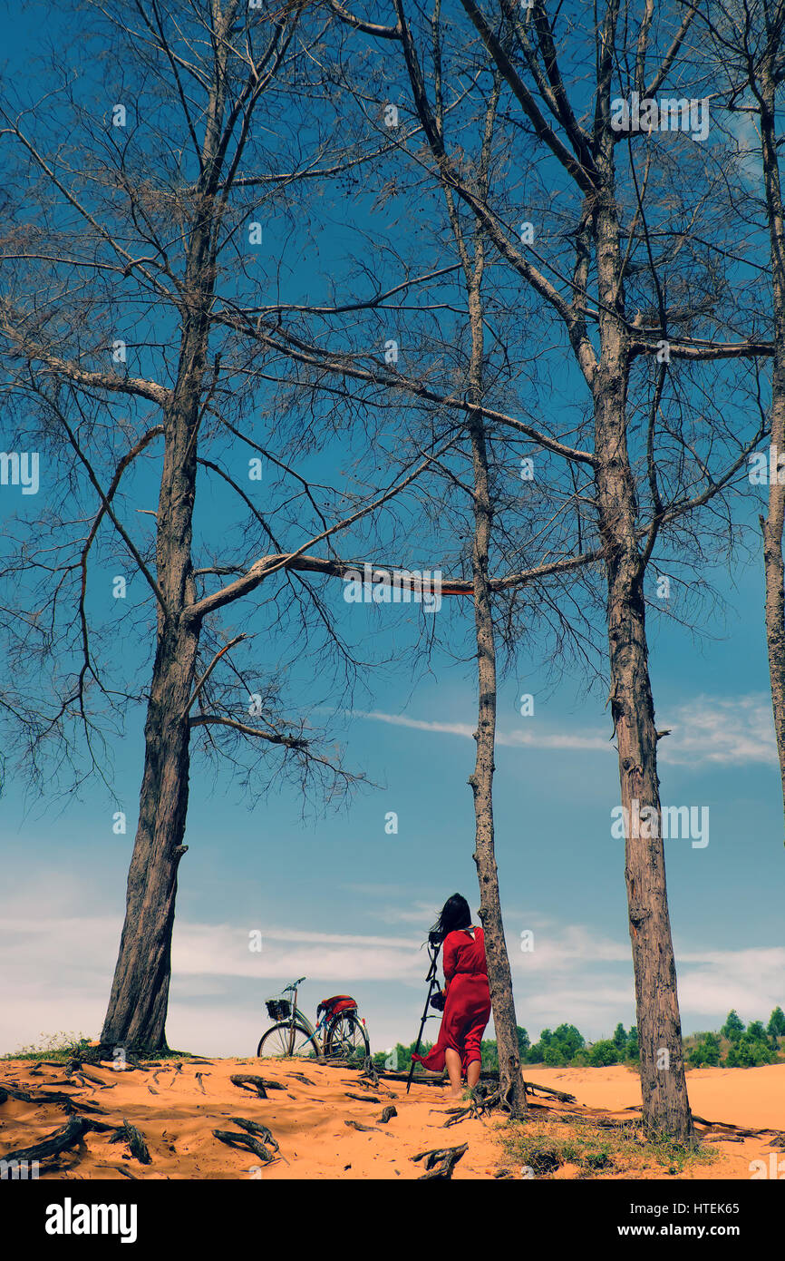 Woman traveling alone at Mui Ne, Vietnam, girl in red dress and selfie ...