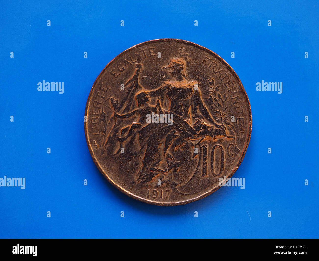 ancient french coin 10 cents over blue background Stock Photo - Alamy