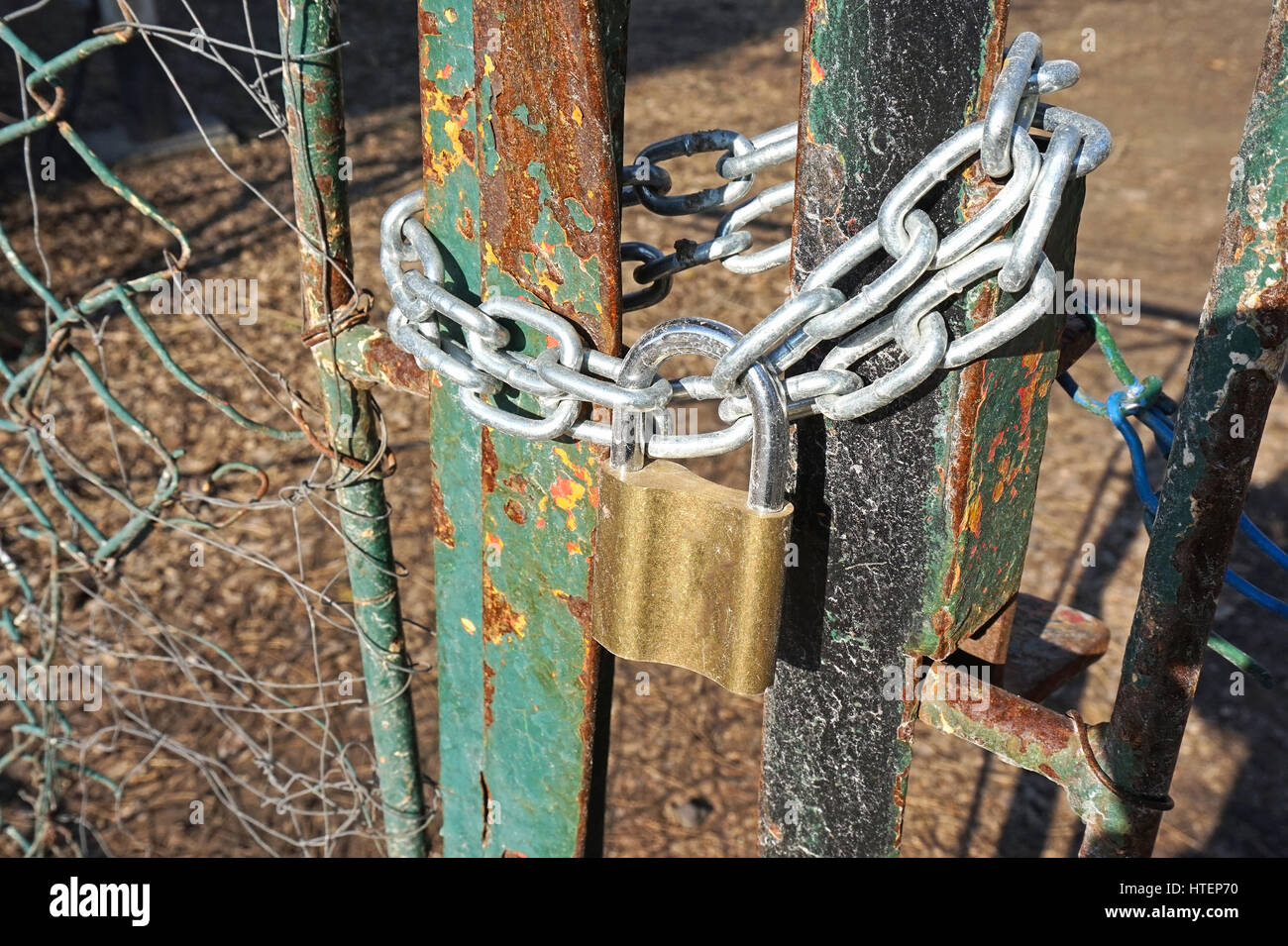 Closed metal door with padlock and chain Stock Photo - Alamy