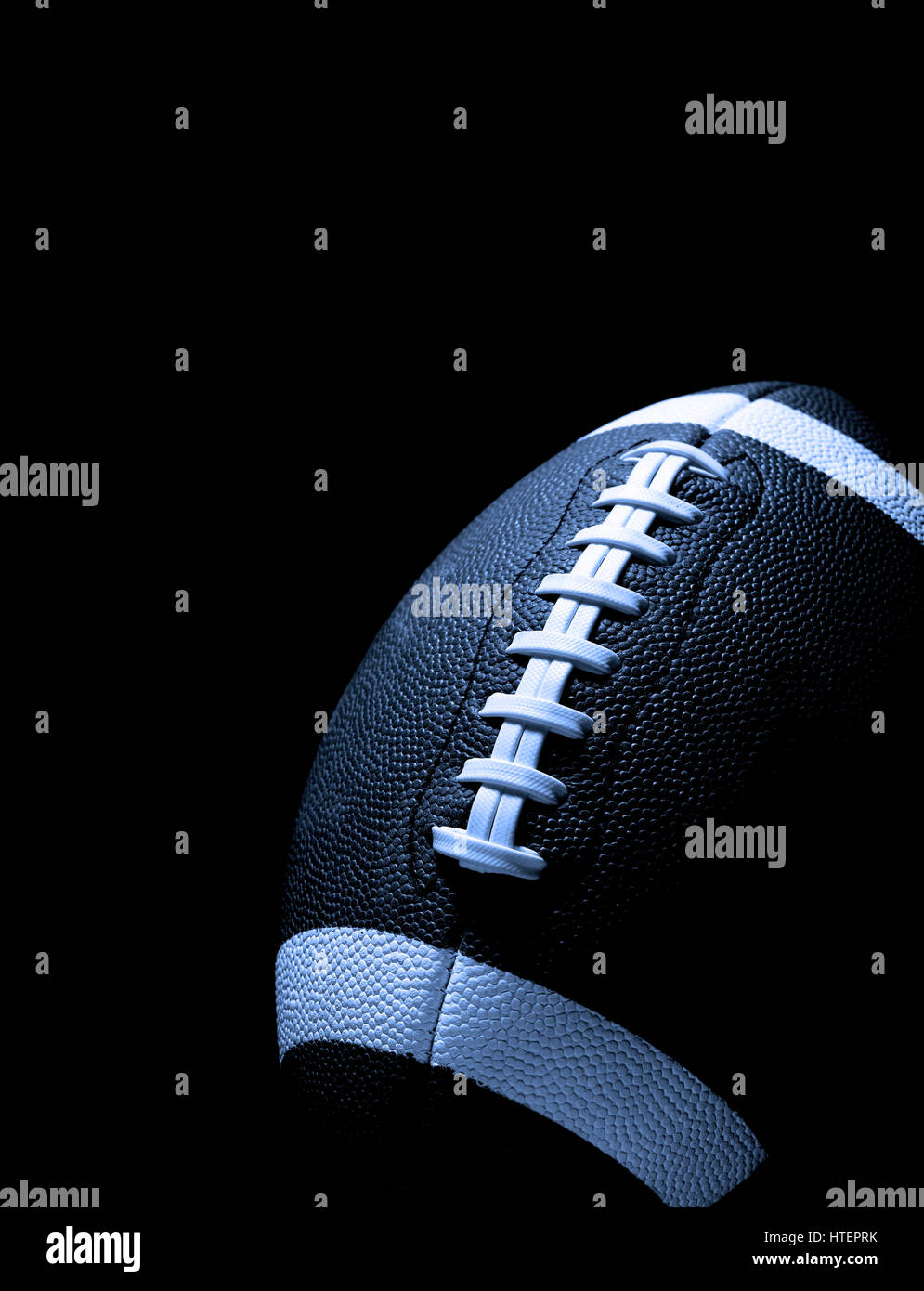 Flying Football on Black Stock Photo - Alamy