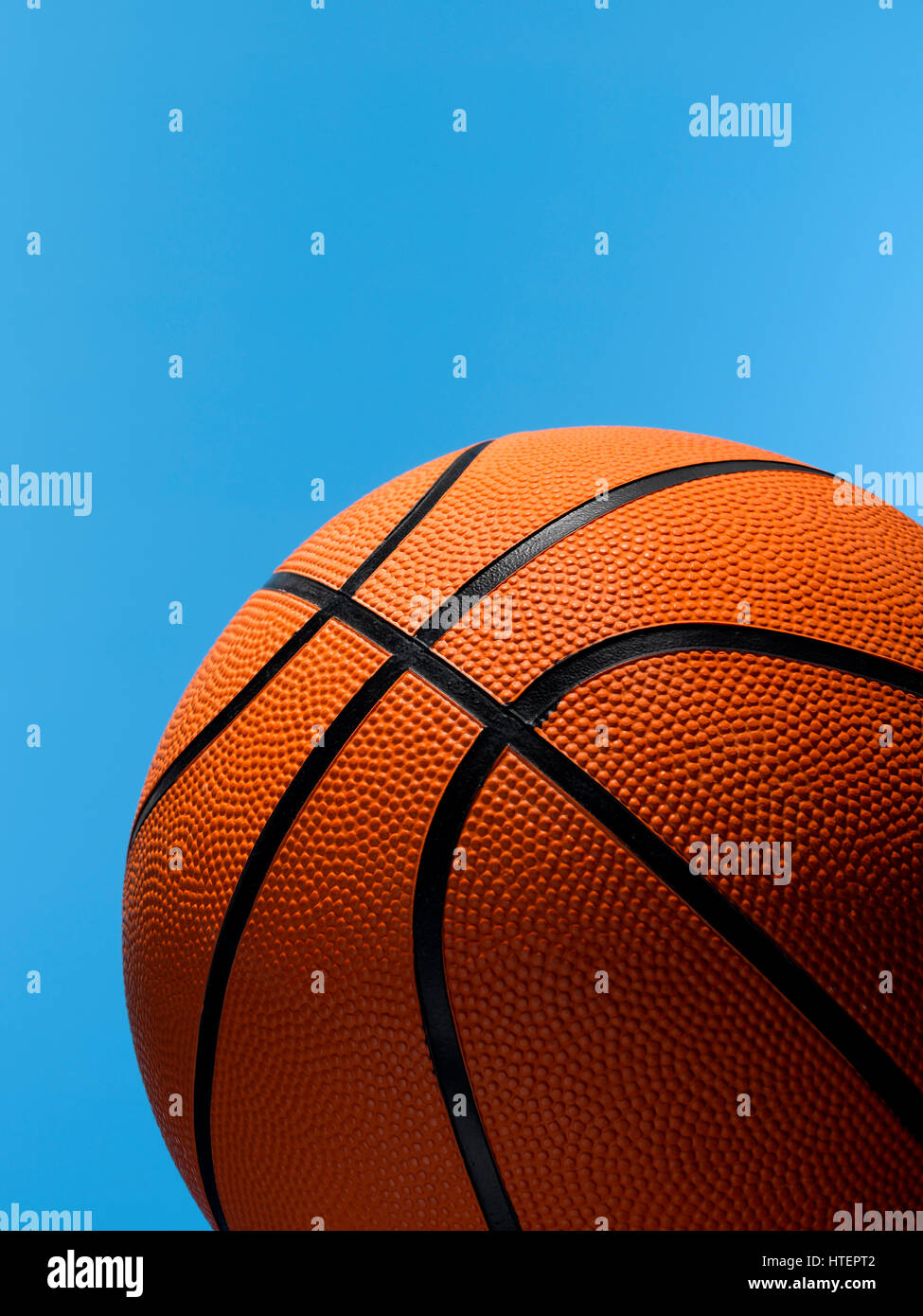 Single Basketball on blue Stock Photo - Alamy