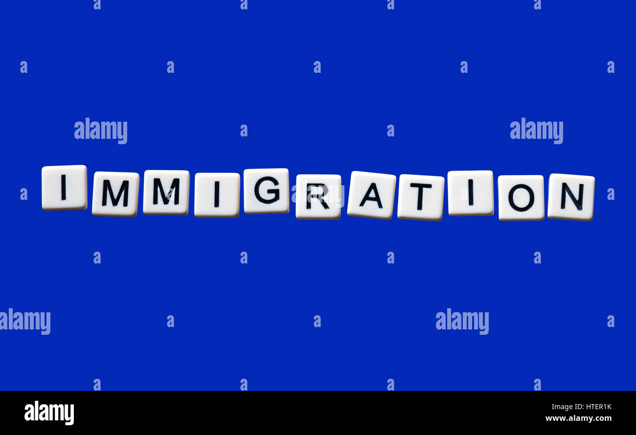 Immigration highlighted on white blocks Stock Photo - Alamy