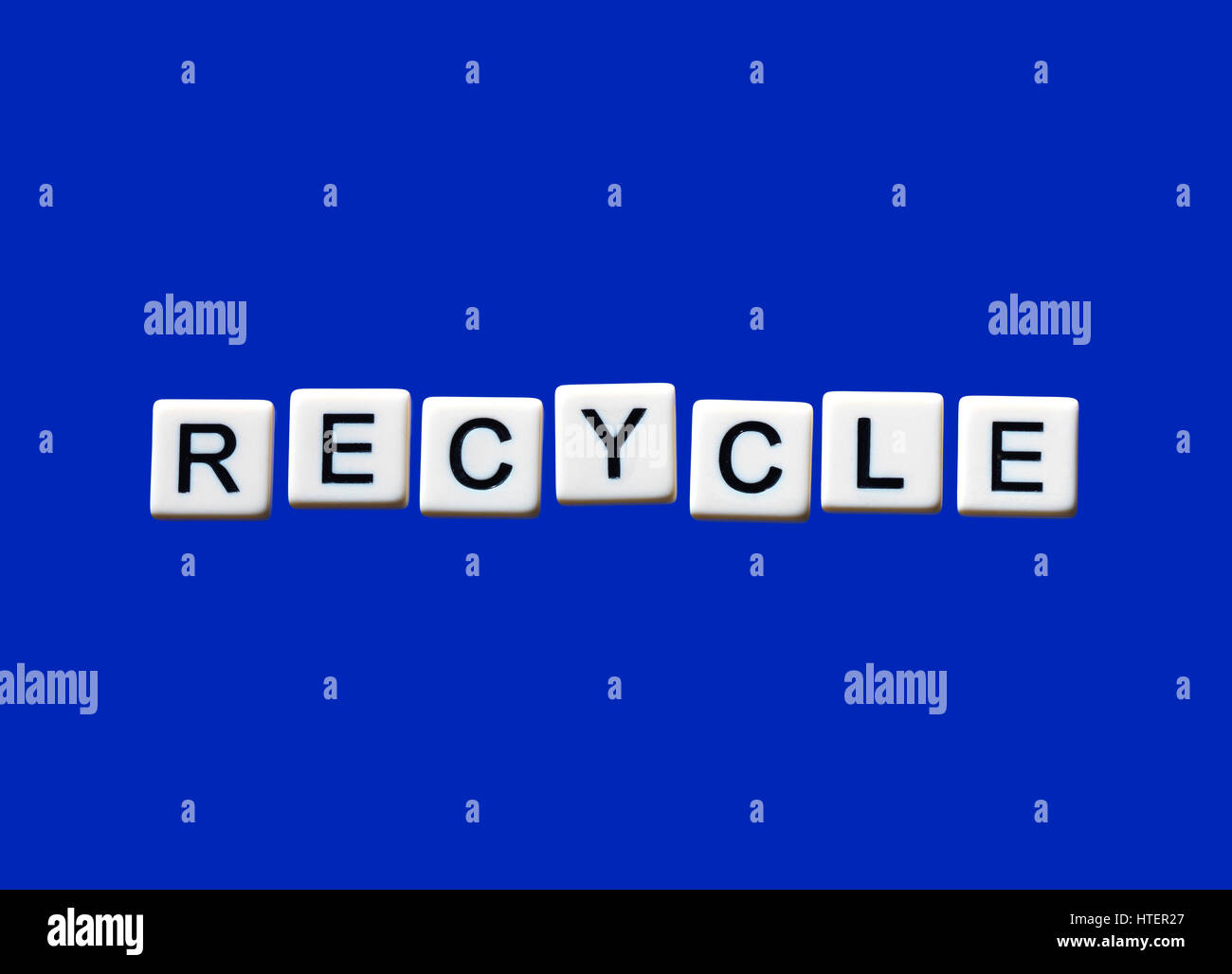Recycle highlighted on white blocks Stock Photo - Alamy
