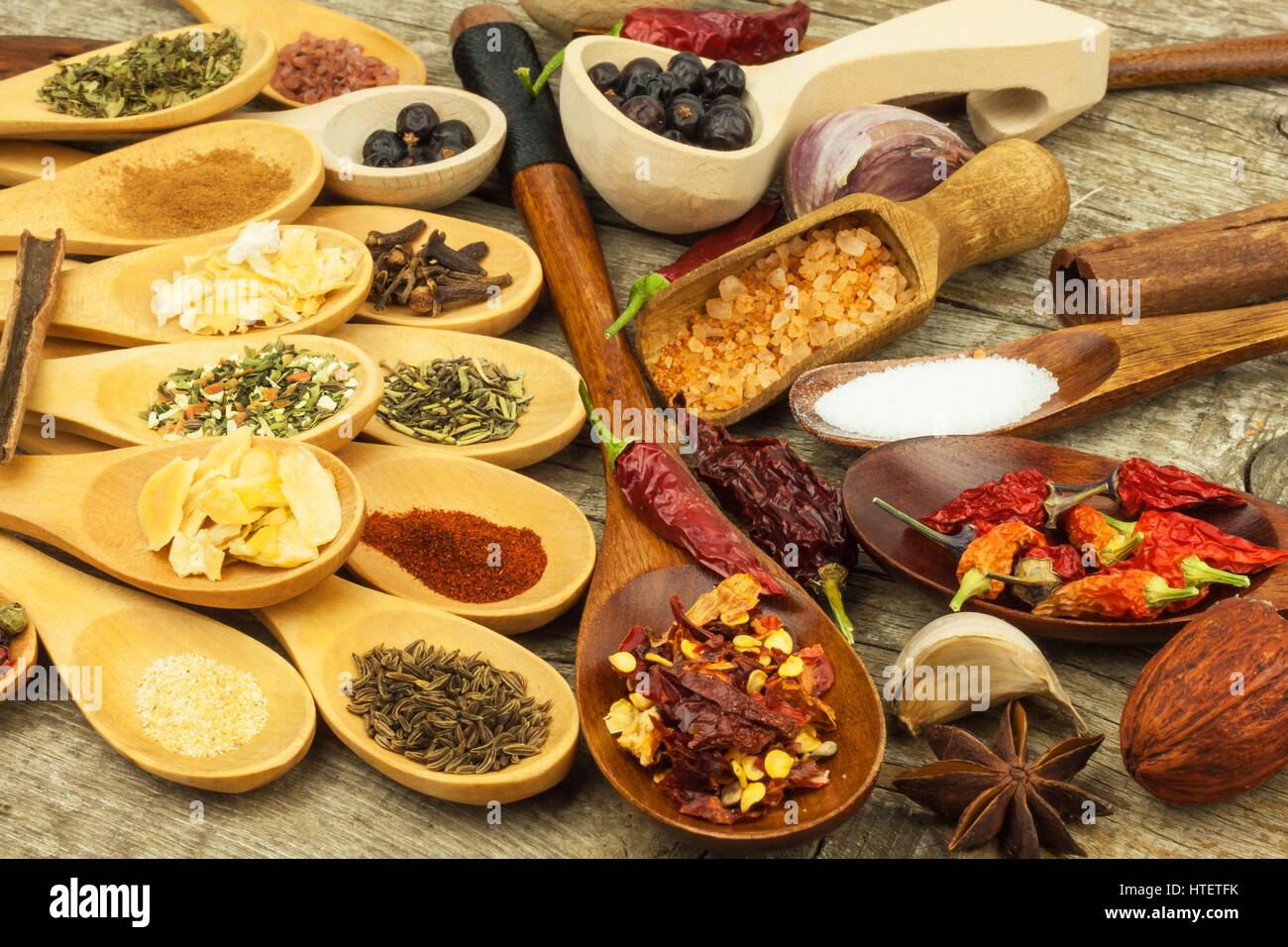 Spices on wooden spoons. Sales of exotic spices. Seasoning food ...