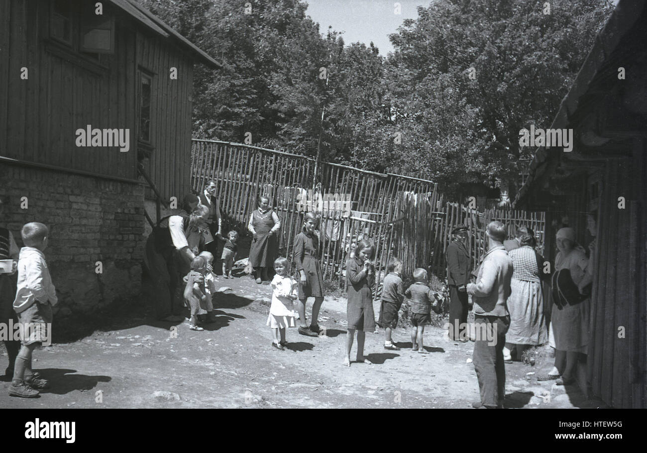 1930s, rural Bohemian family together outside their farm buildings in ...