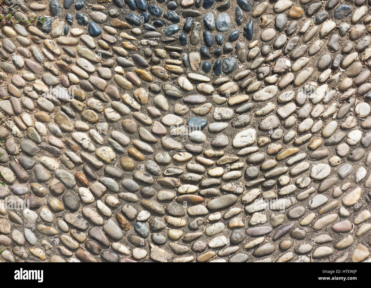 background made of a closeup of a wall with pebbles Stock Photo - Alamy
