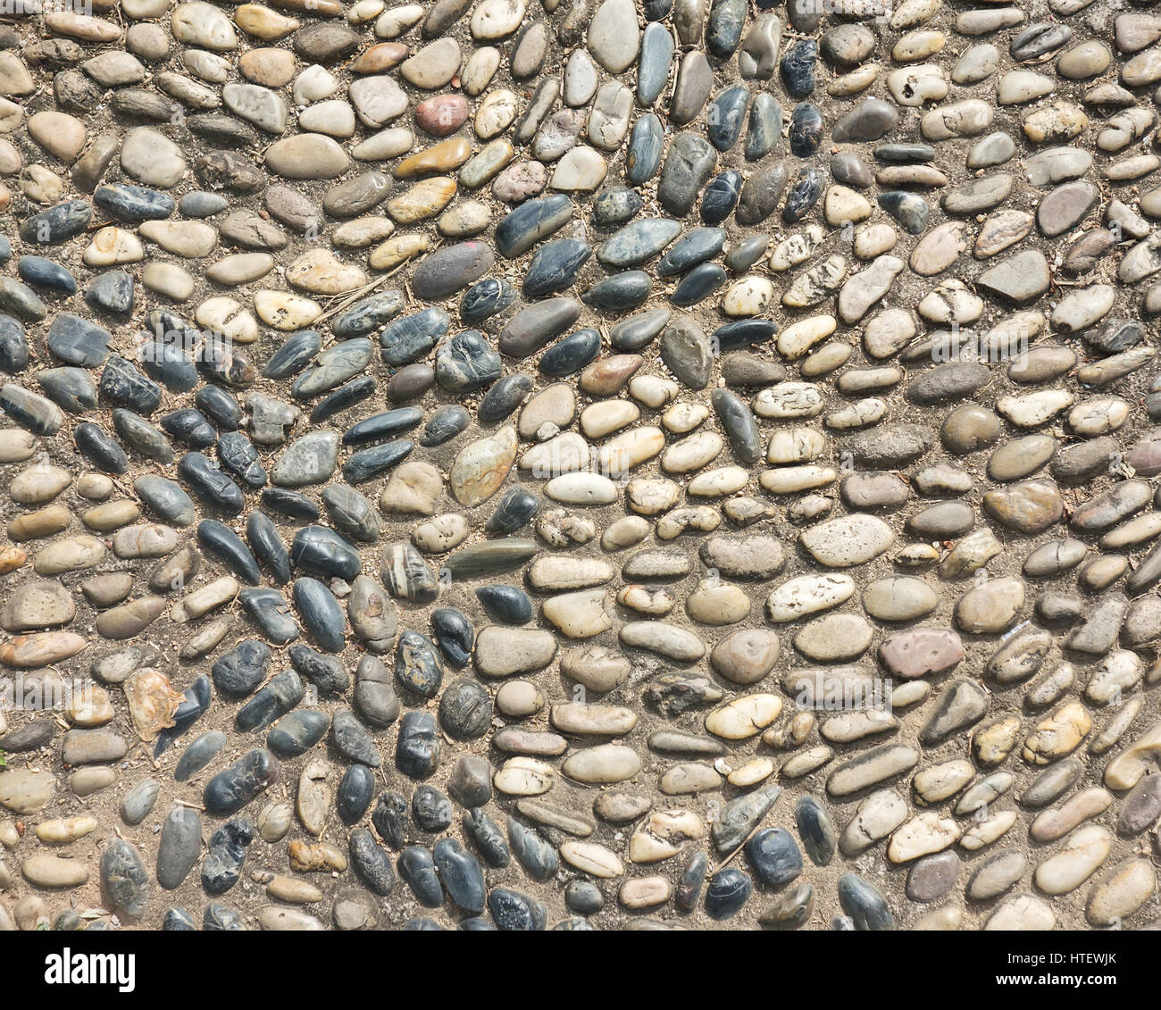background made of a closeup of a wall with pebbles Stock Photo - Alamy