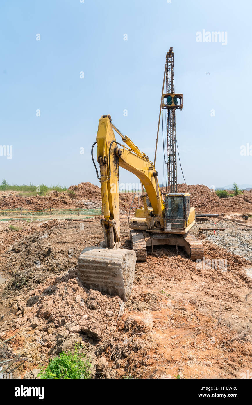 Heavy earth mover with blue sky in the background Stock Photo - Alamy