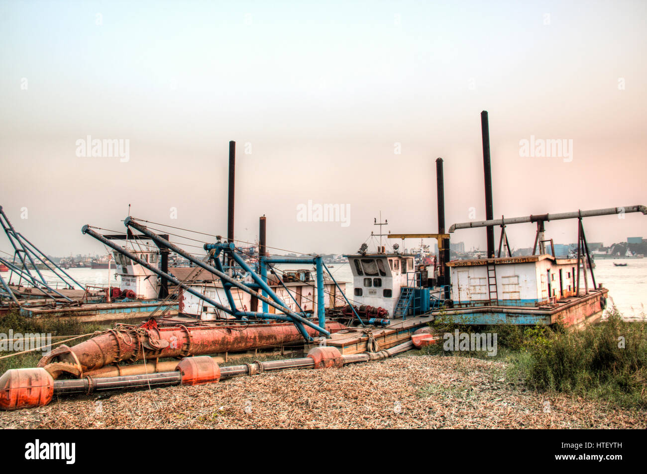 Old boats in the very busy port in the center of Chittagong in ...