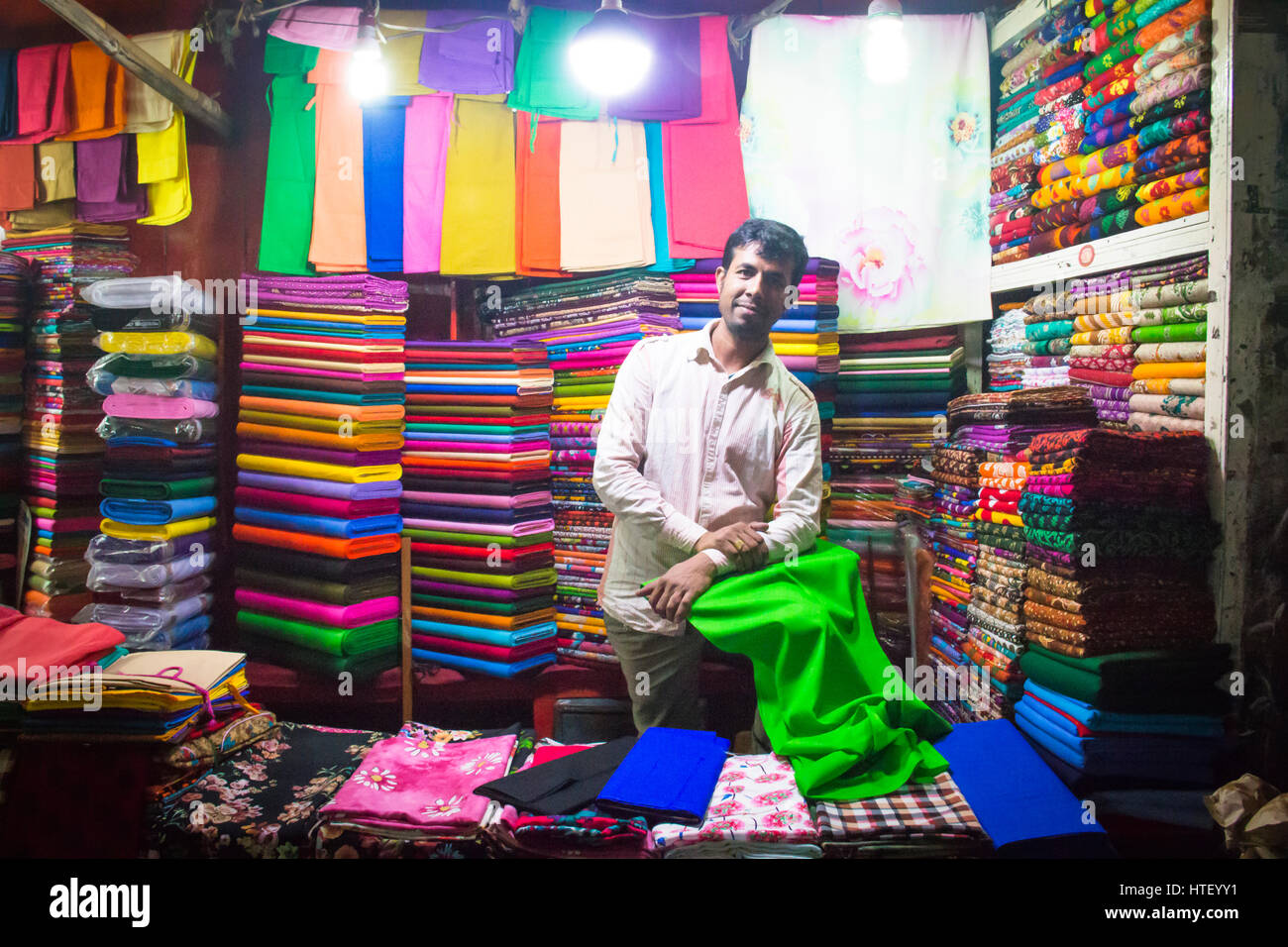 CHITTAGONG, BANGLADESH - FEBRUARY 2017: Man with a small shop selling ...