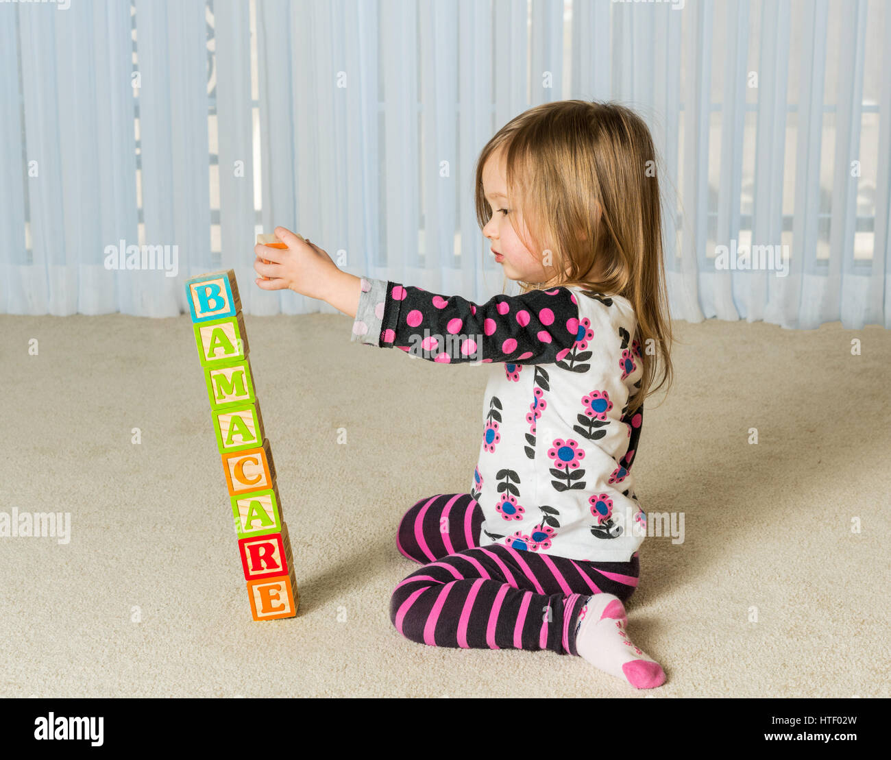 Knocking over toddler hi-res stock photography and images - Alamy