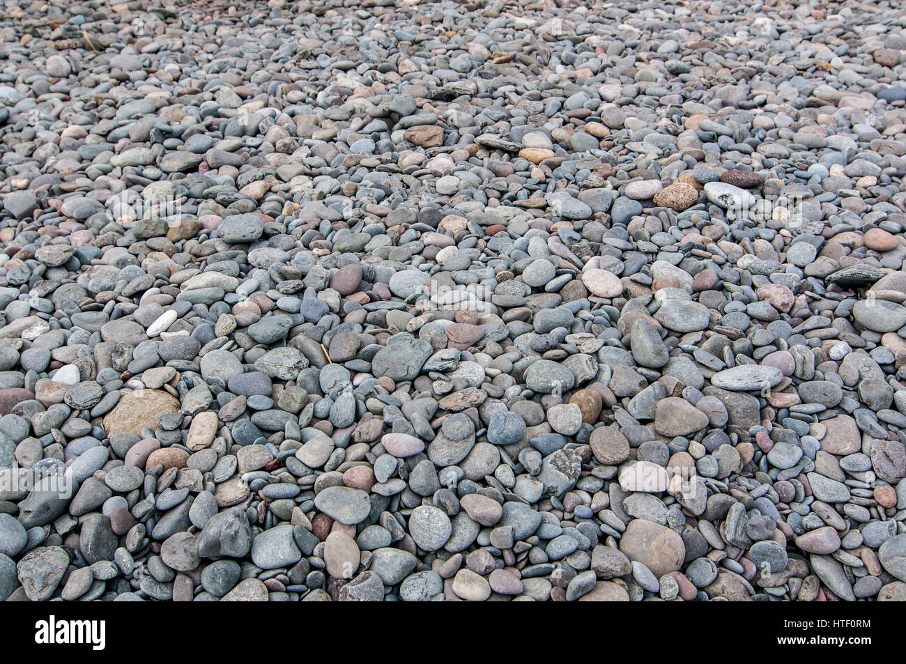 Pebbles of different sizes and colors, Playa del Águila, Gran Canaria ...