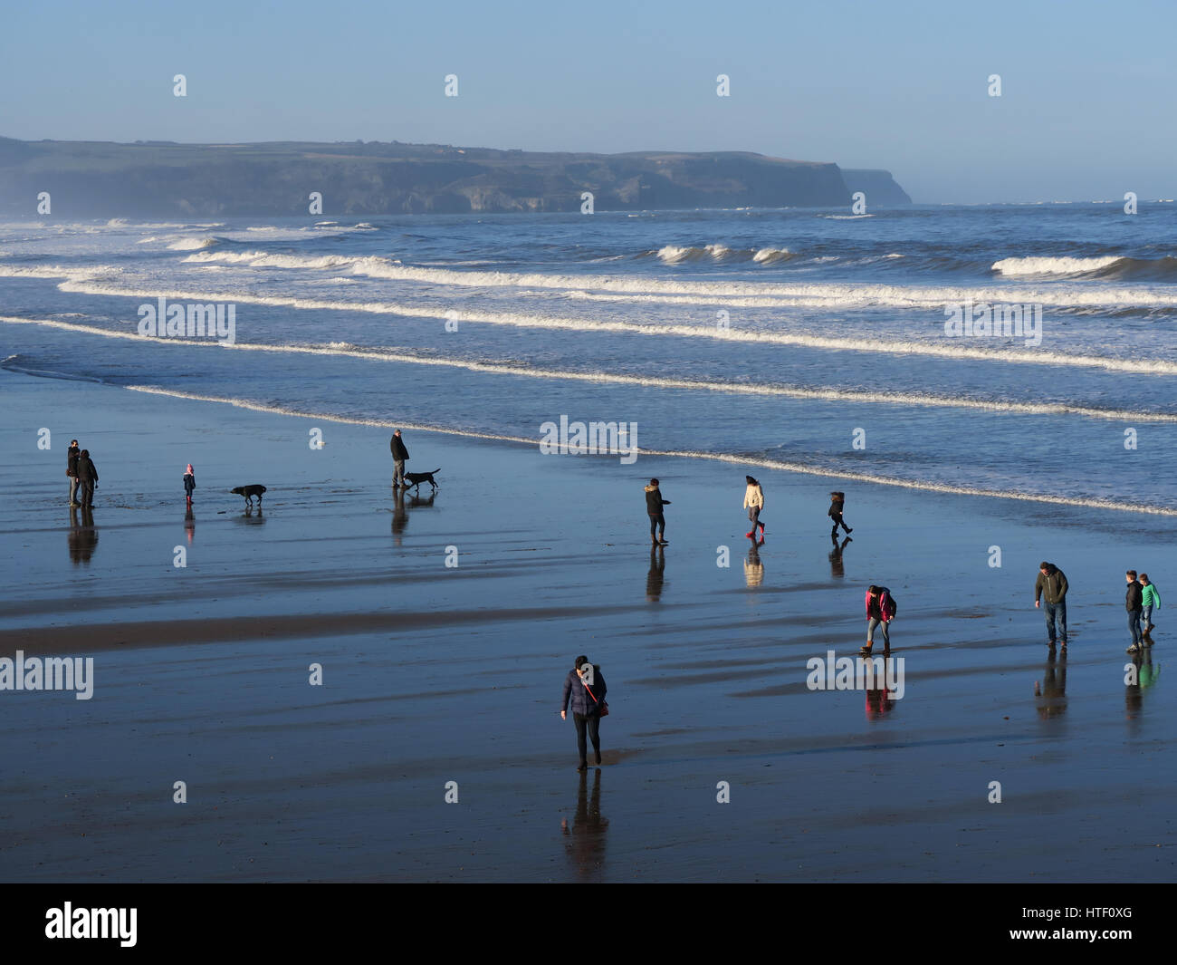 Beach scene with waves at whitby Stock Photo - Alamy