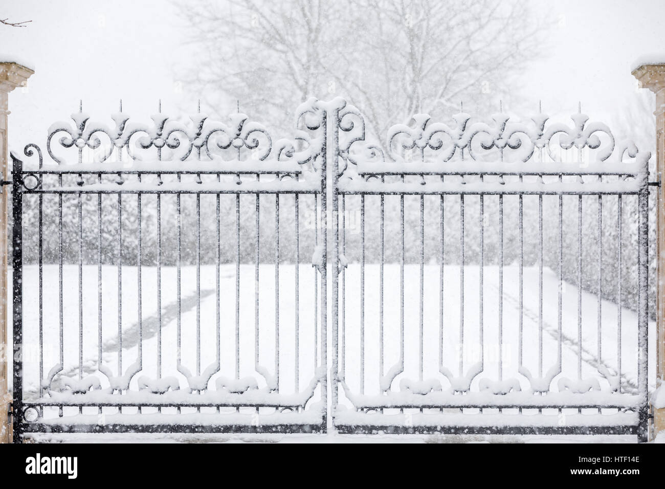 gate and drive to home in a snow storm Stock Photo - Alamy