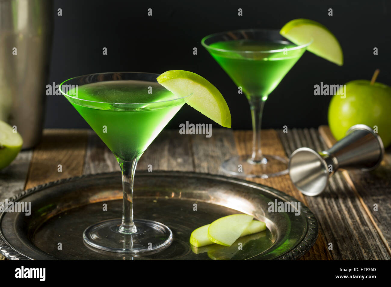 Homemade Green Alcoholic Appletini Cocktail with Apple Garnish Stock ...