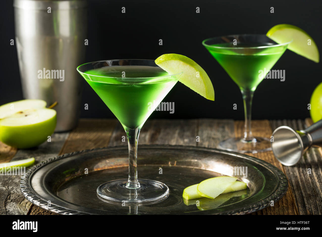 Homemade Green Alcoholic Appletini Cocktail with Apple Garnish Stock ...