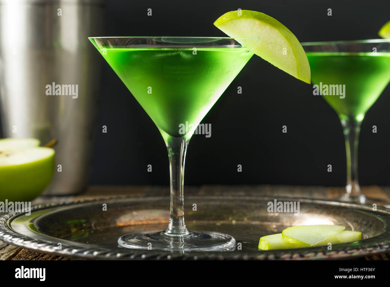 Homemade Green Alcoholic Appletini Cocktail with Apple Garnish Stock ...