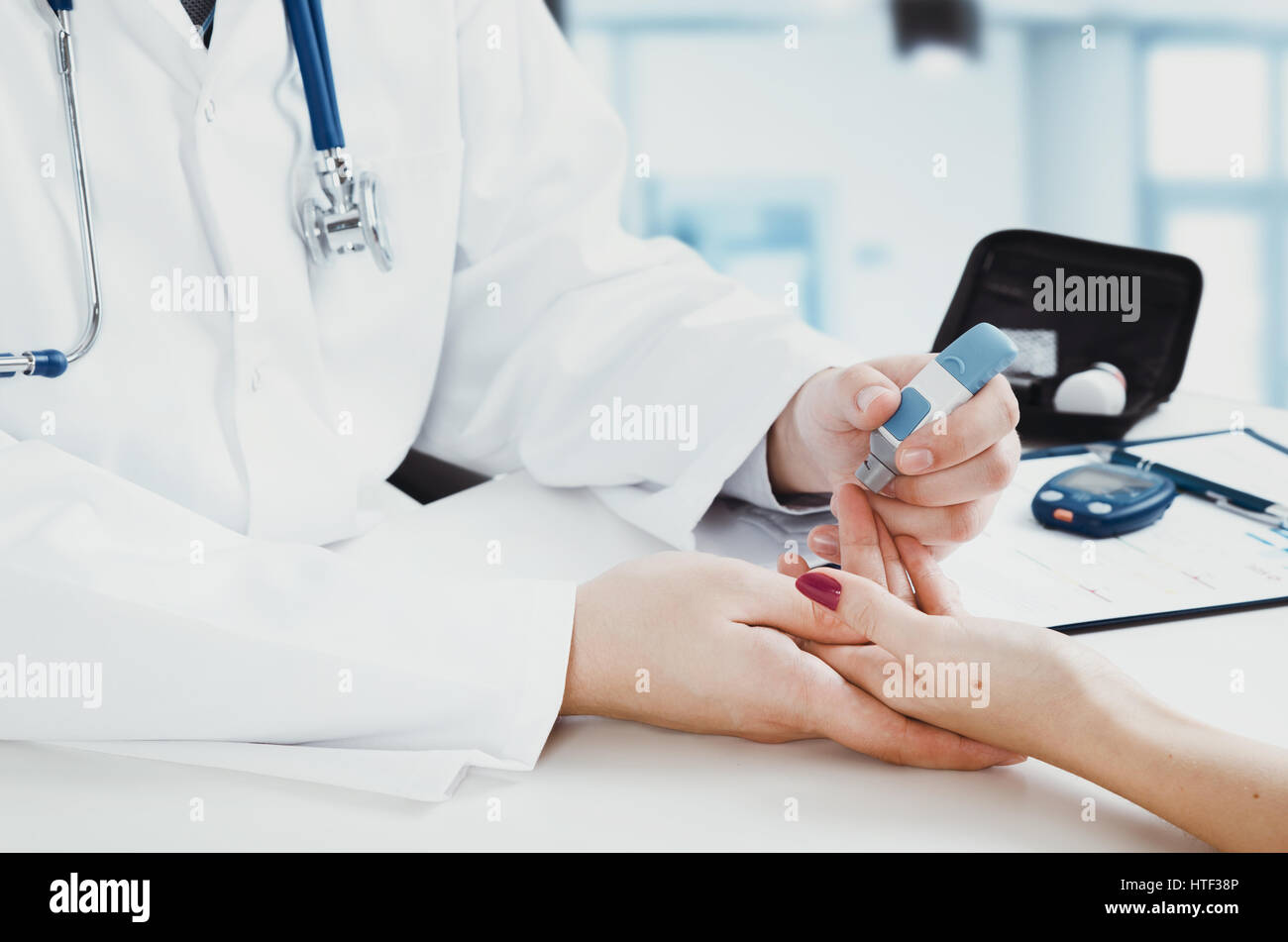 Doctor checking blood sugar level. doctor patient diabetes lancet ...